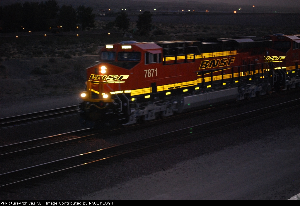 BNSF 7871 with BNSF 7869 behind her lighten up the night with their Swoosh BNSF Reflective logo ...